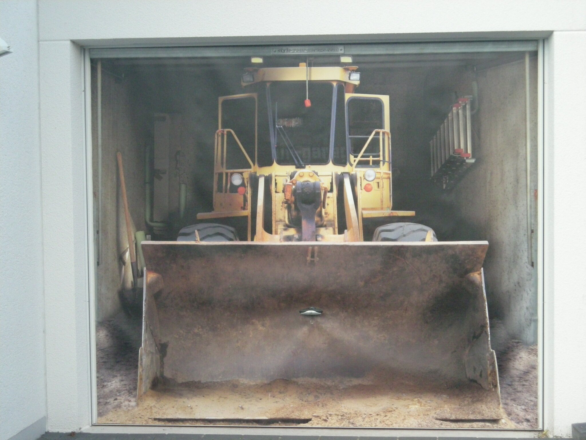 Wie kommt der Bagger in die Garage?